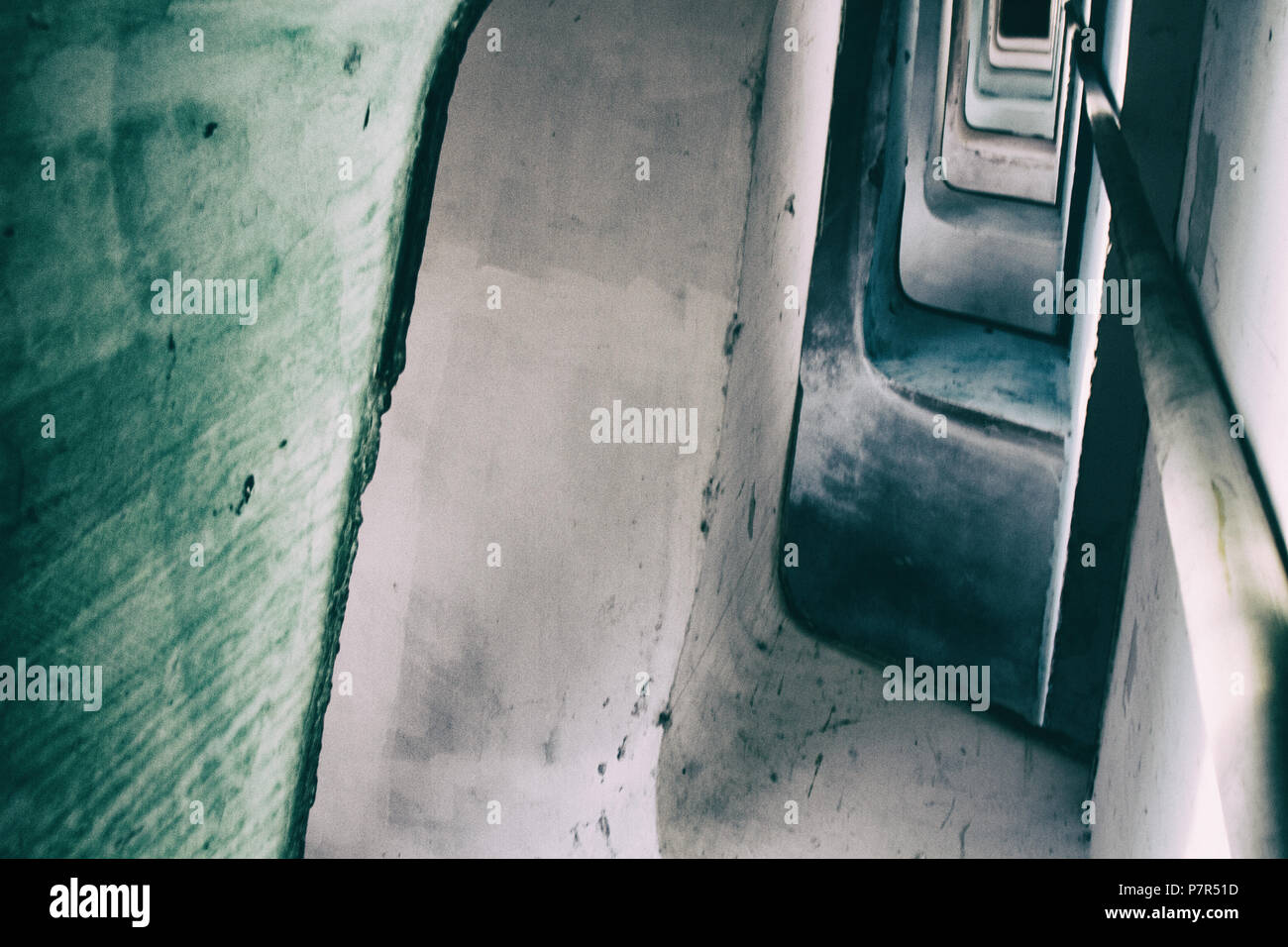 Spiral decayed stairs in a cracked building with 27 floors Stock Photo ...