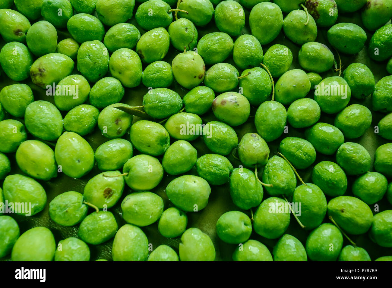 Green raw olives hi-res stock photography and images - Alamy