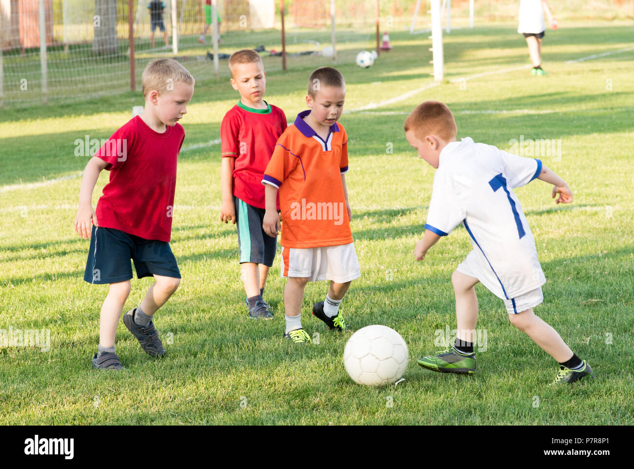 Kids soccer football - young children players match on soccer field ...