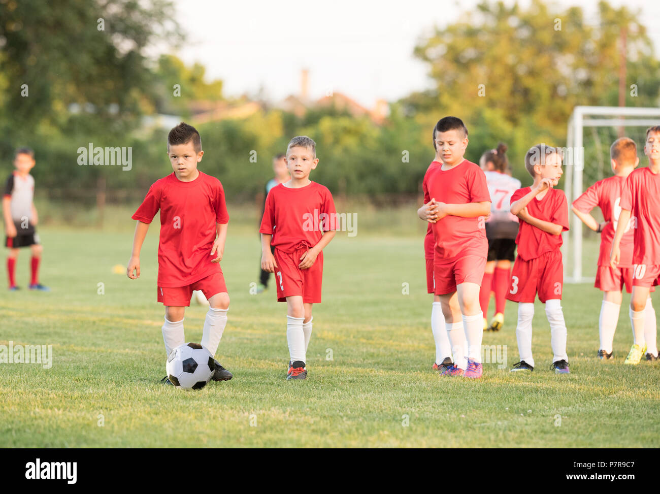 Kids soccer football - small children players exercising before match ...