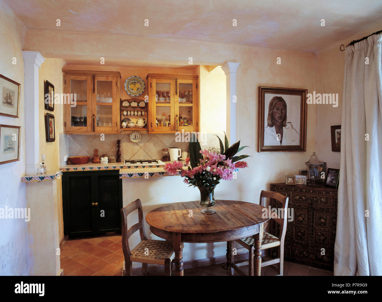 Antique wooden table and chairs in Mallorcan cottage kitchen dining ...