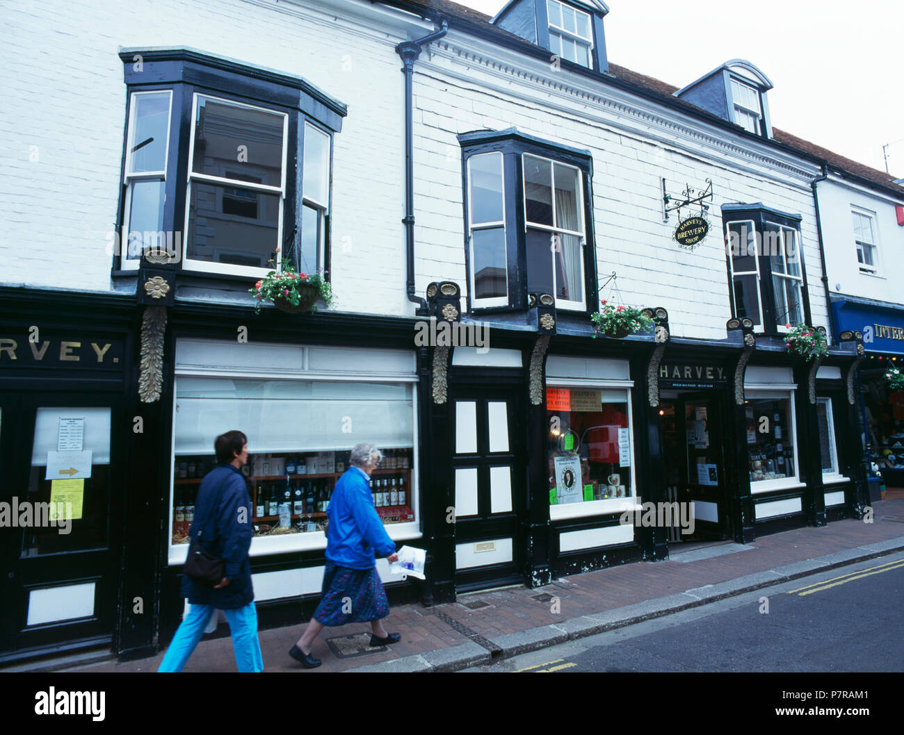People walking past shops in English country town FOR EDITORIAL USE ...
