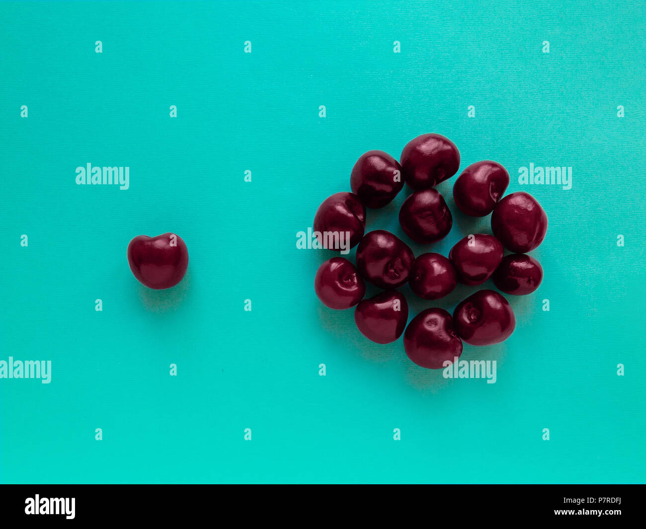 Cherry Top view Many ripe cherries are lying in the round shape on blue ...