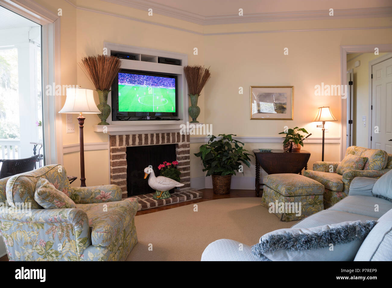 Upscale Residential Den with Large Screen TV and Fireplace, USA Stock ...