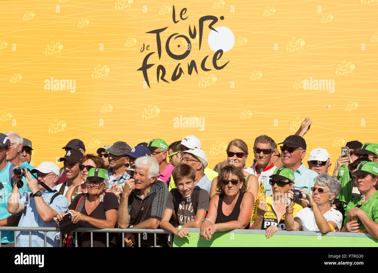 Fans line the side of the road during stage one of the Tour de France ...