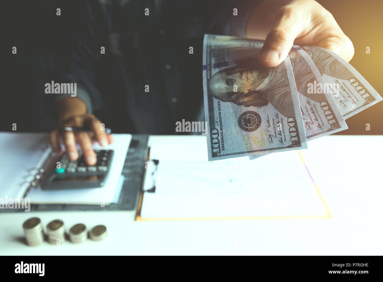 Hand holding banknote. Saving money, financial and accounting concept ...