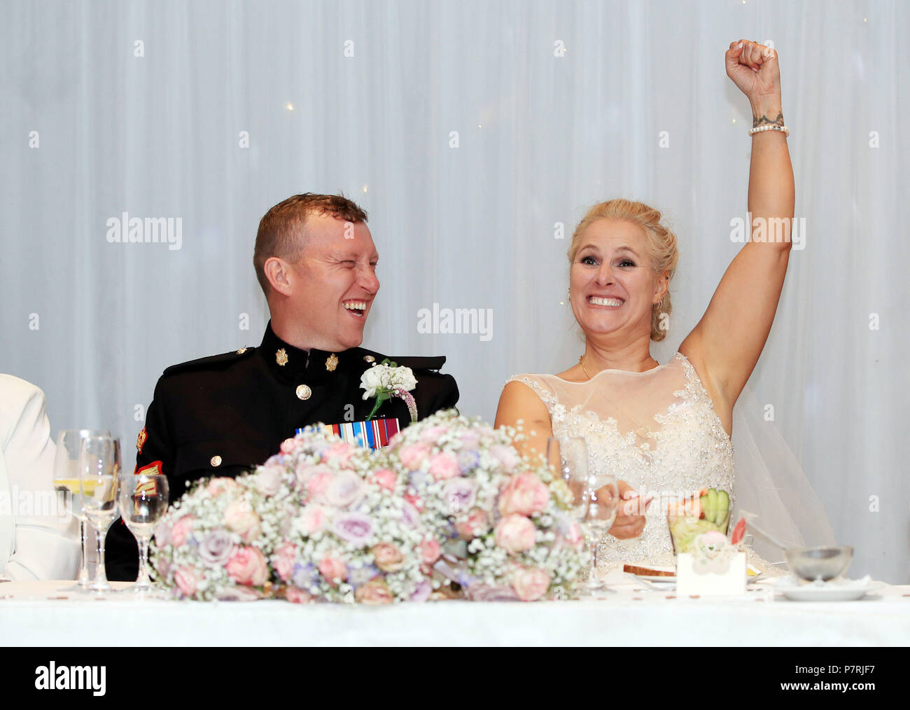 Football-mad bride Nadine Hanlon and her husband Lee react while ...
