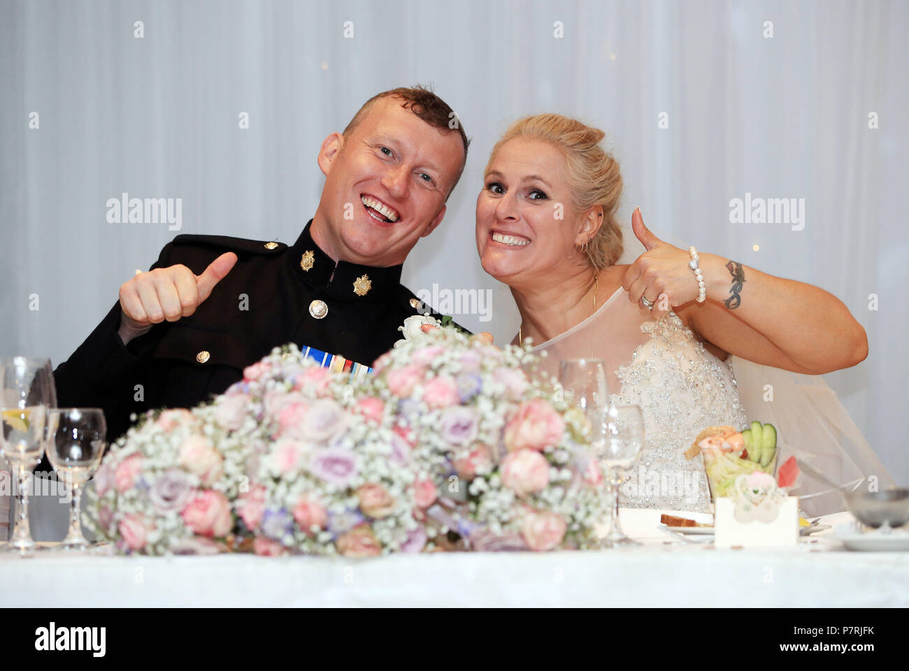 Football-mad bride Nadine Hanlon and her husband Lee watching coverage ...