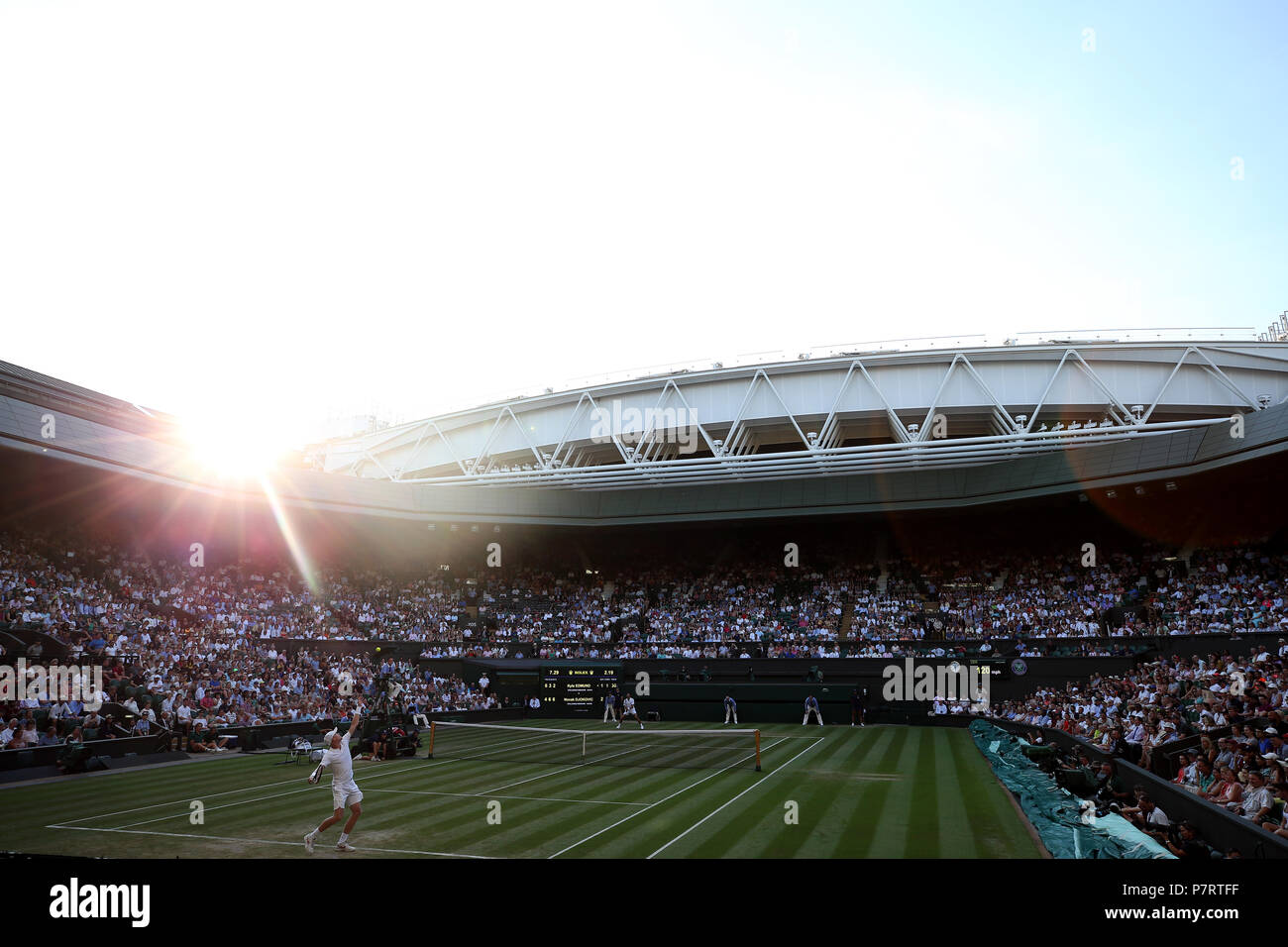 Kyle Edmund serves to Novak Djokovic on centre court on day six of the ...