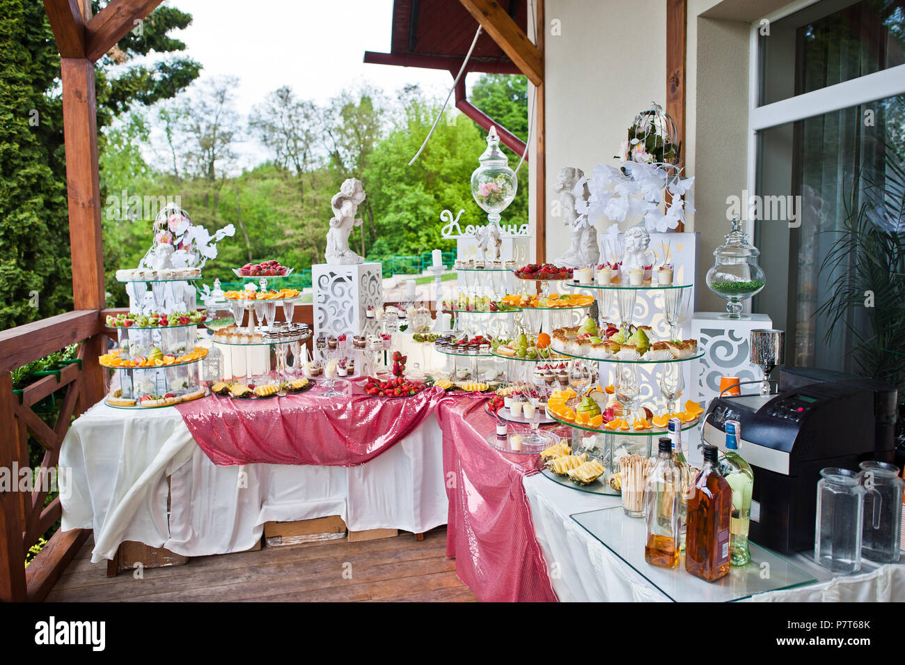 Catered table full of different snacks and fruits. Wedding banquet ...