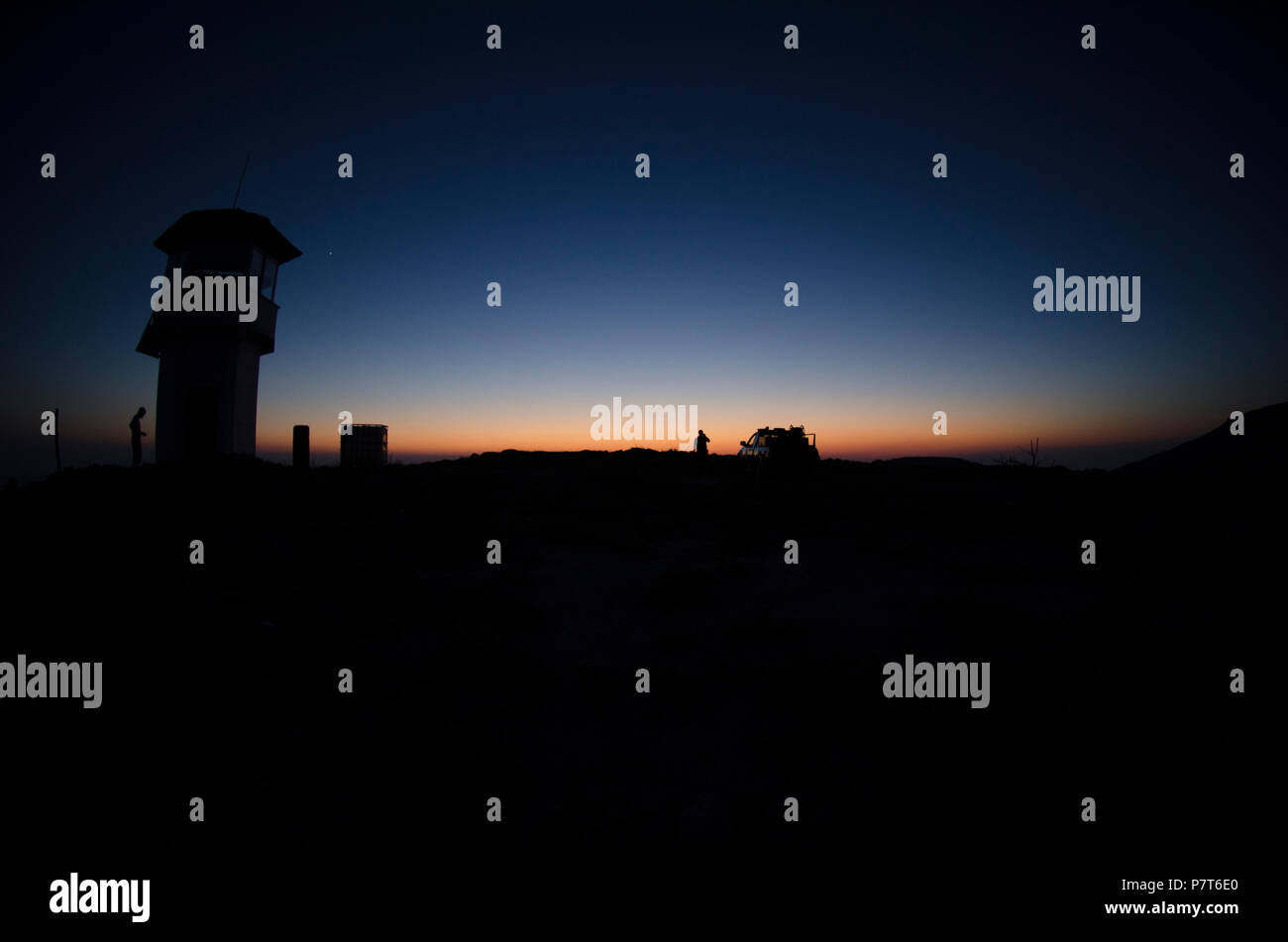 Human silhouette fire lookout station Stock Photo - Alamy