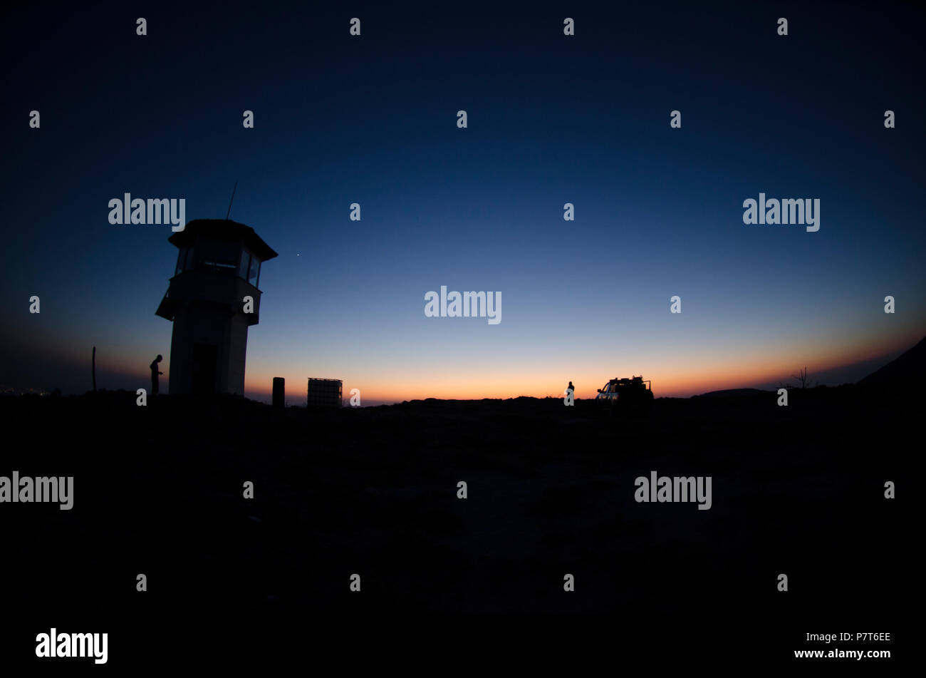 Humans silhouettes fire lookout station Stock Photo - Alamy