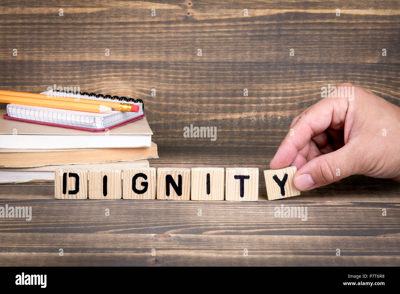 Dignity business concept. Wooden letters on the office desk ...