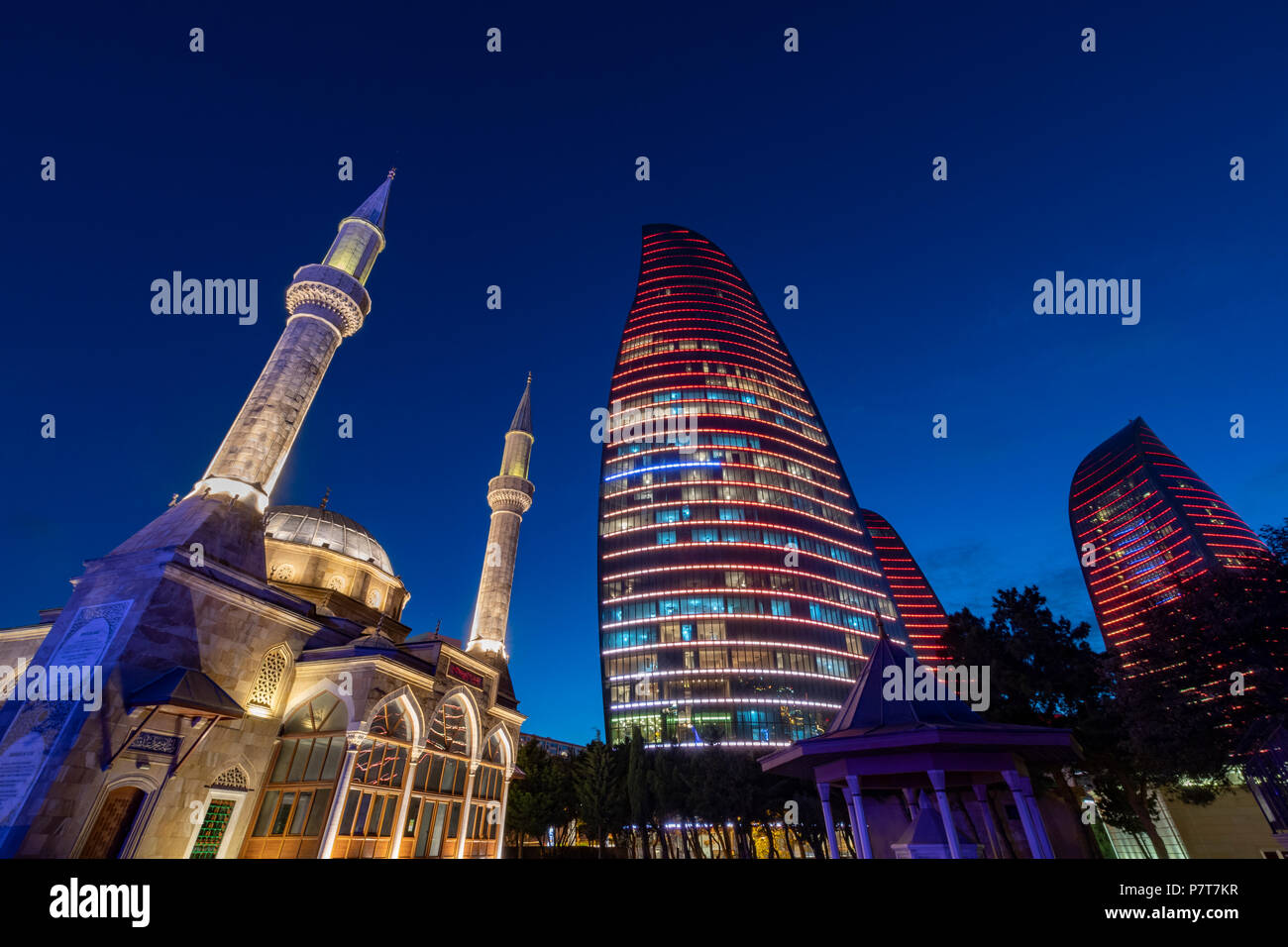 The Flame Towers and Sehidler Xiyabani Mosque at night in Baku ...