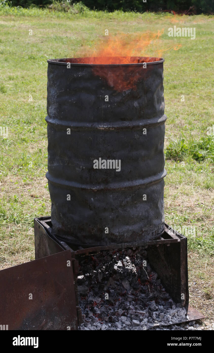 bin with flames that come out to light the fire Stock Photo - Alamy