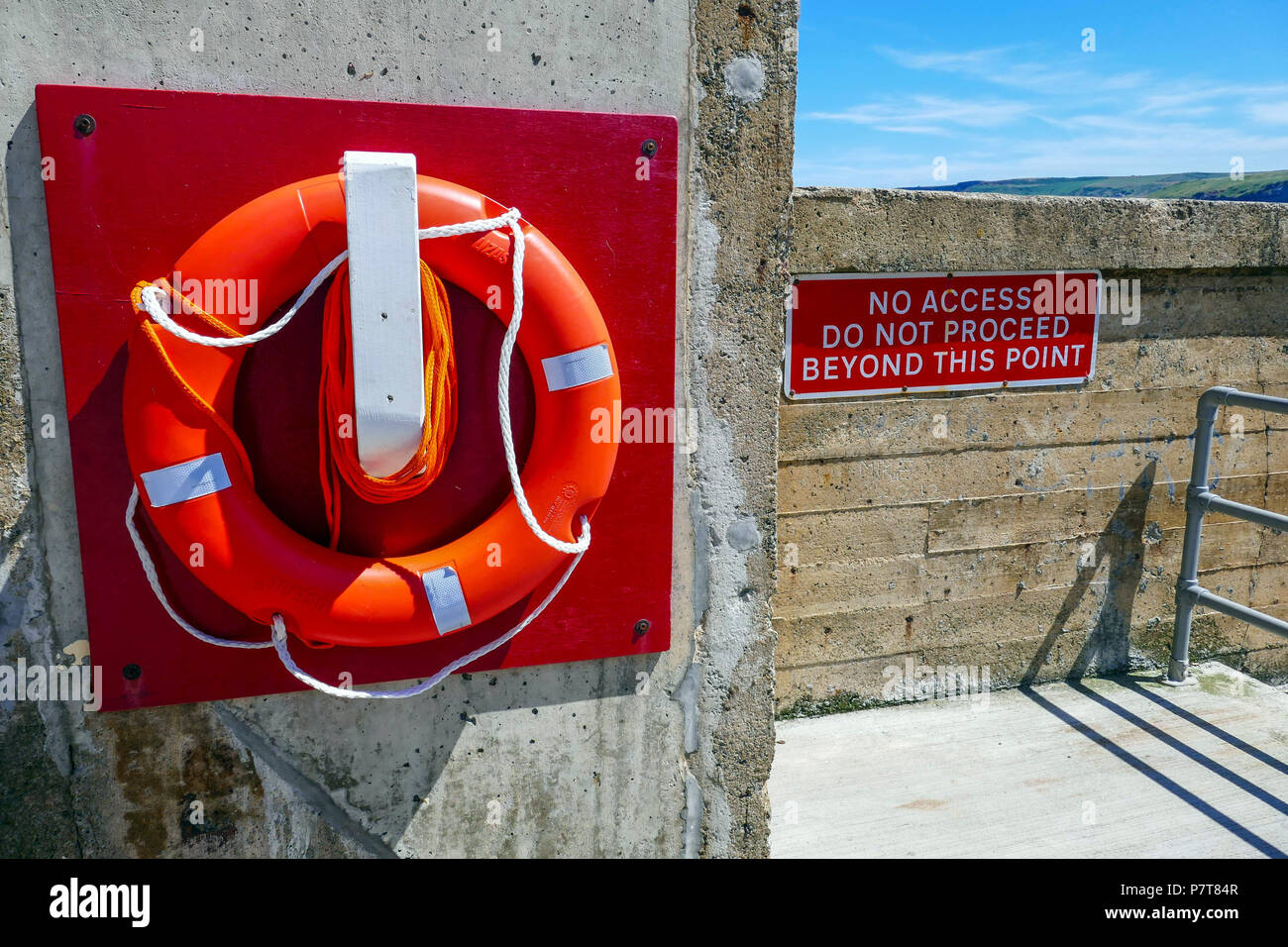 Red Lifebelt, lifebuoy, Hot blue summer day as seaside town of ...