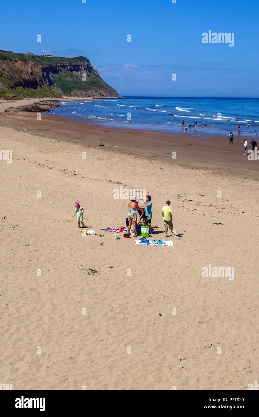 Big sandy beach on hot blue summer day as seaside town of Skinningrove ...