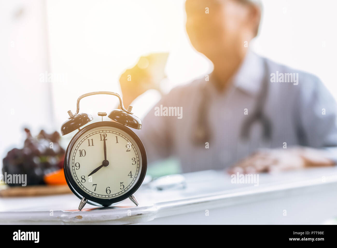 Clock on doctor clinic table for times to healthcare checkup time ...