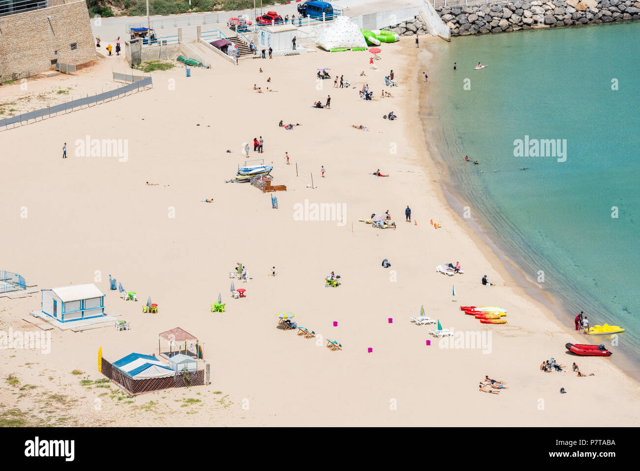 Aerial view of the Quemado beach full of people in Al Hoceima, Morocco ...