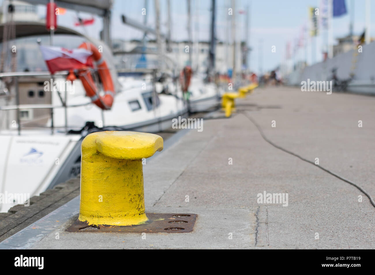 Harbor bollard for large naval vessels. The port wharf in central ...