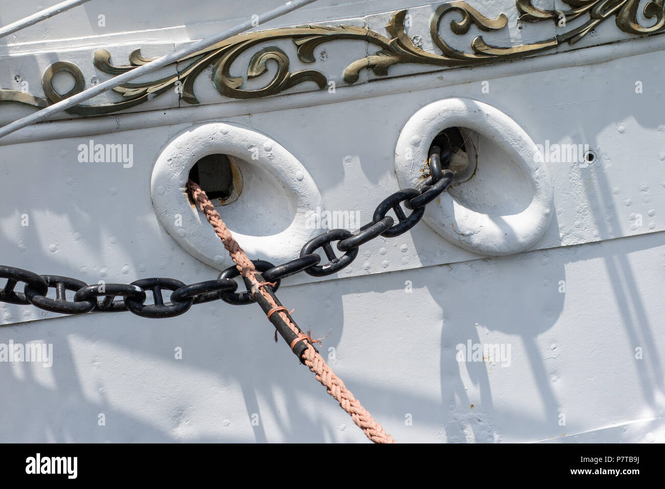 Ship mooring rope on the port wharf. Harbor bollard for large naval ...