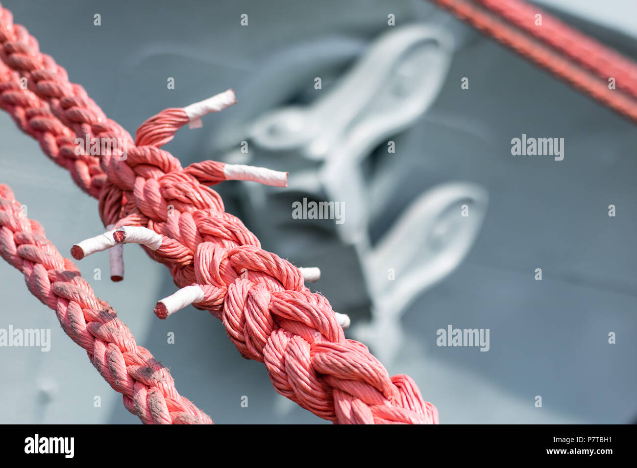 Ship mooring rope on the port wharf. Harbor bollard for large naval ...
