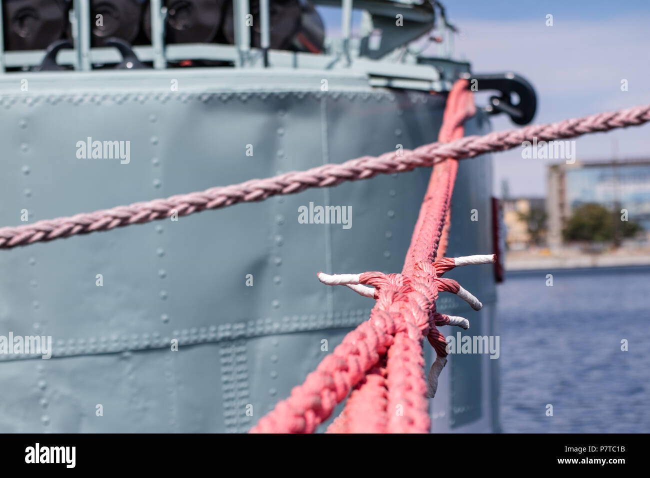 Ship mooring rope on the port wharf. Harbor bollard for large naval ...