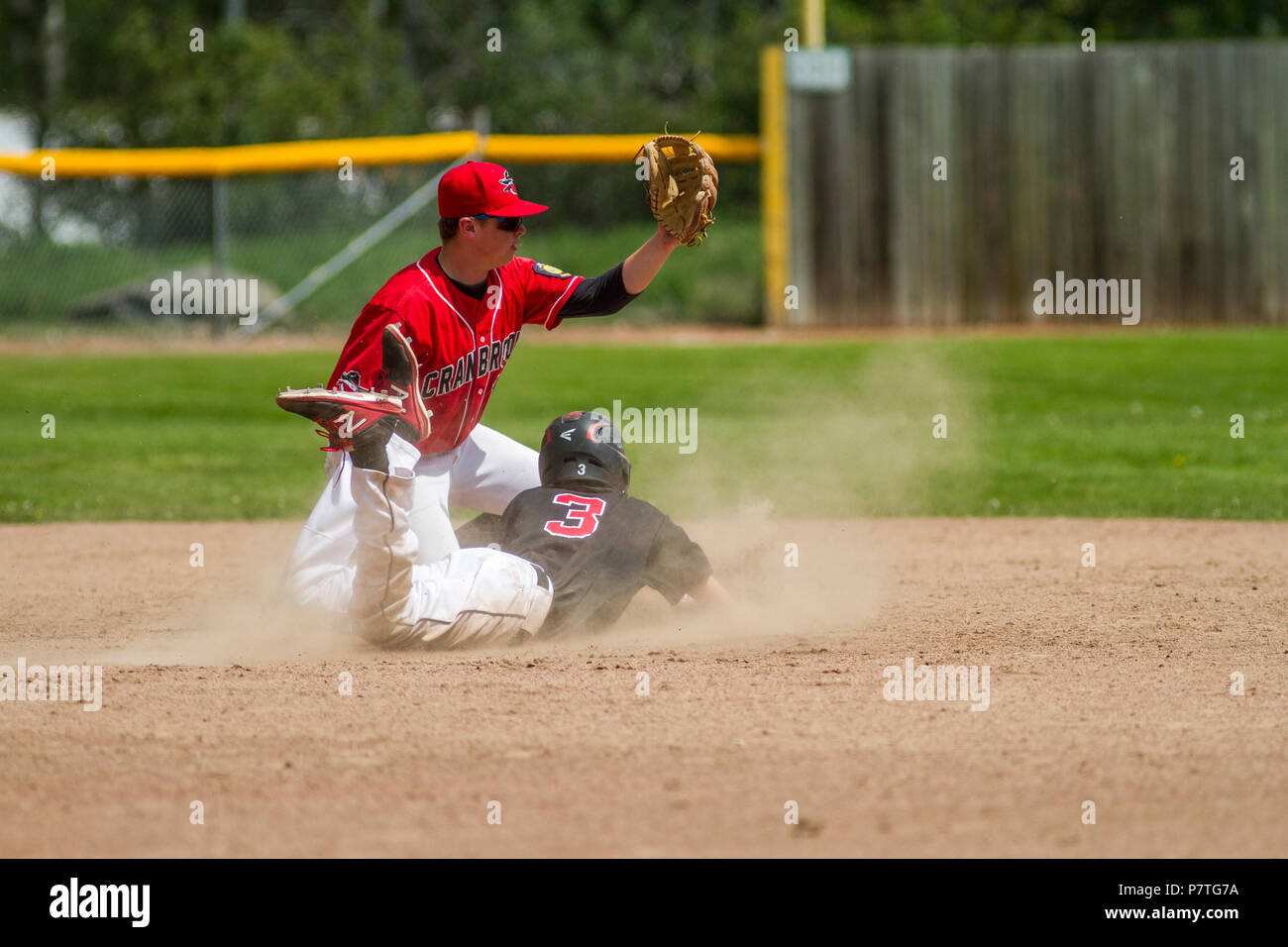 Senior man swinging baseball bat Stock Photo - Alamy