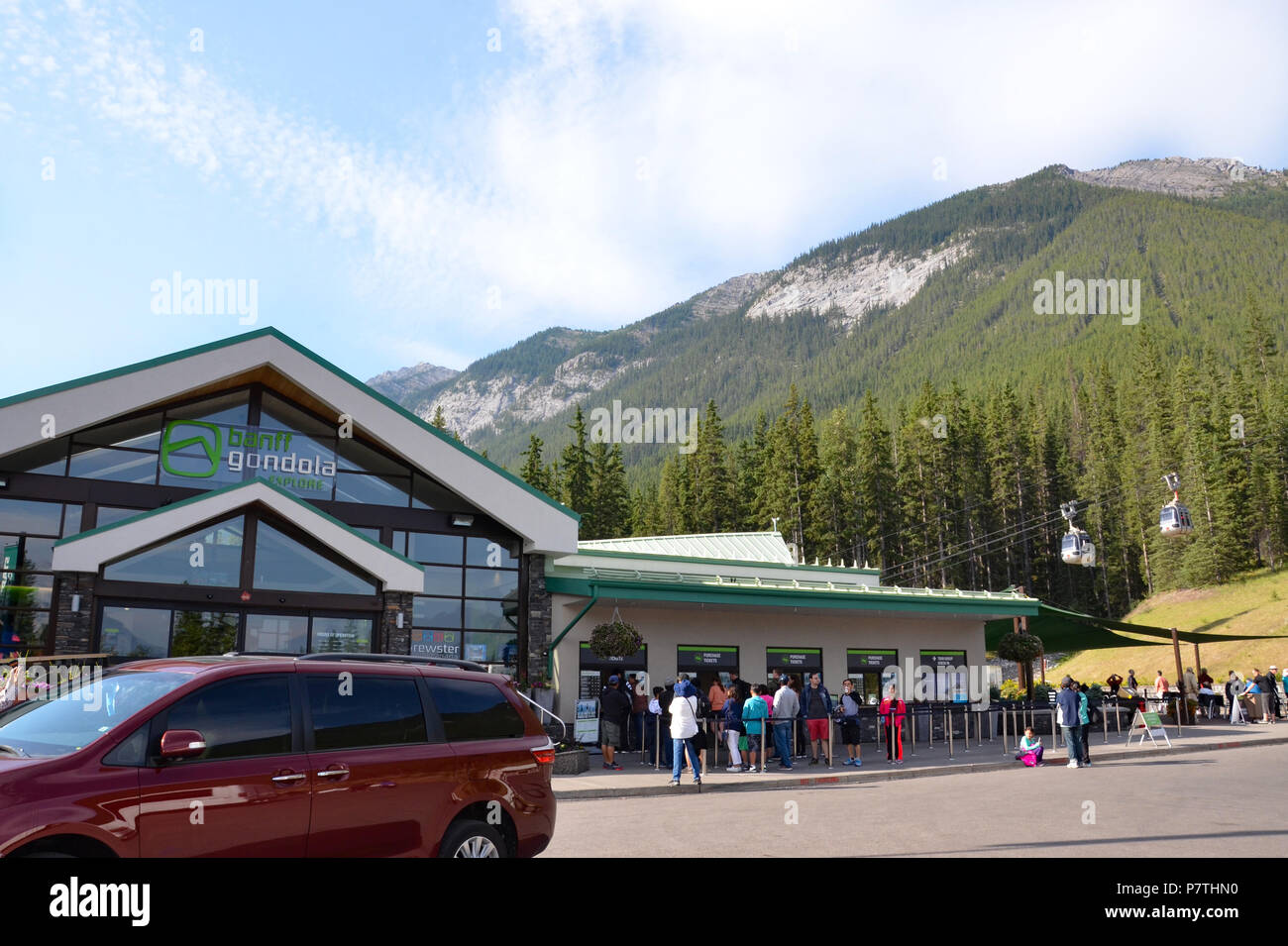 BANFF, AB / CANADA - JULY 27, 2017: Visitors line up to get tickets to ...