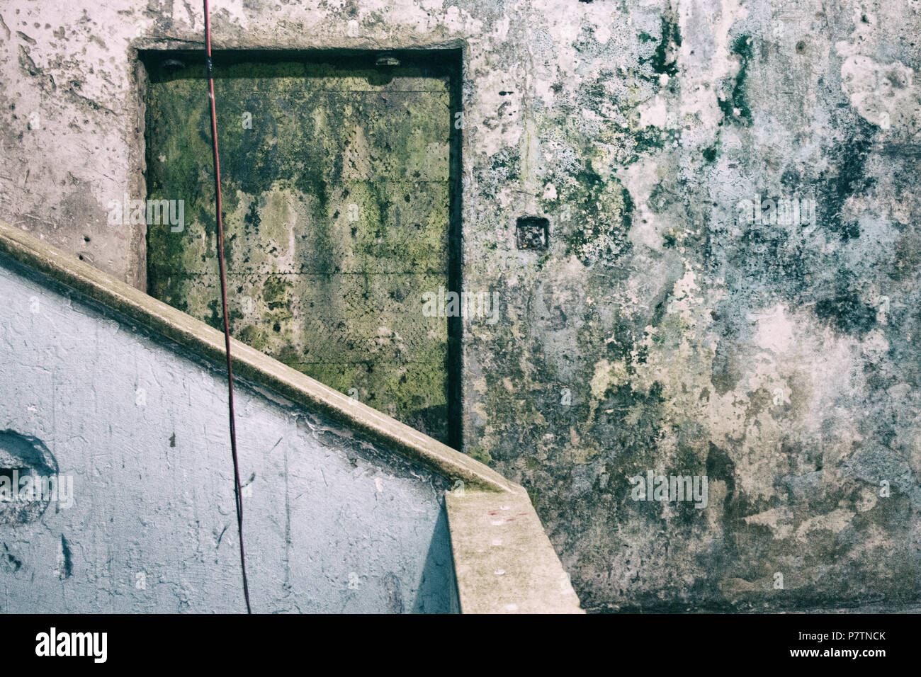 Cracked door and walls in a condemned building. No people Stock Photo ...