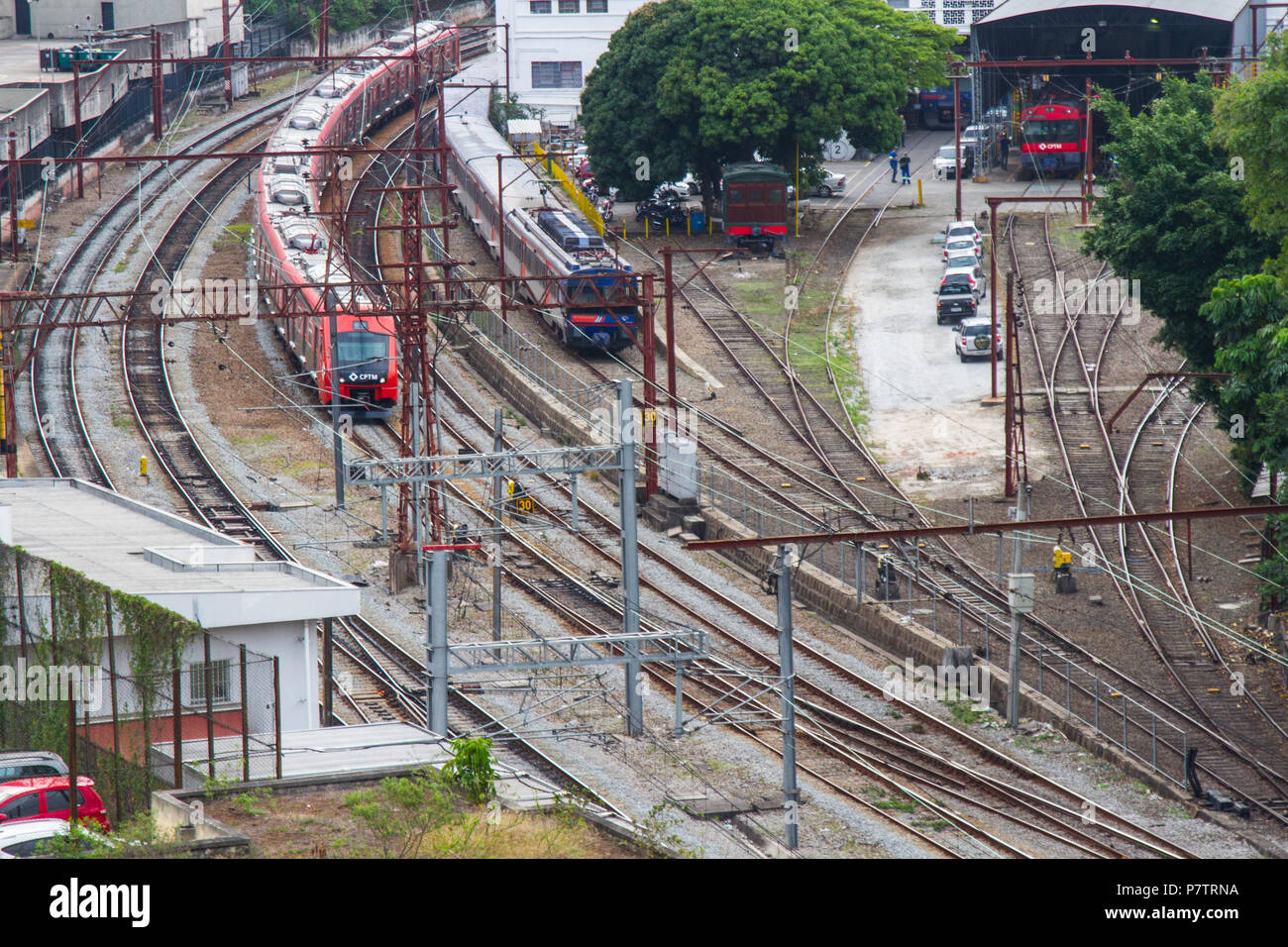 Red, blue and silver trains Stock Photo - Alamy