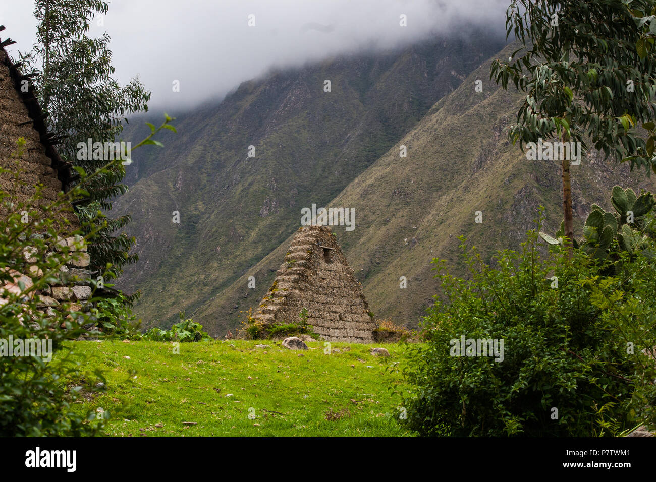 Ancient Inca ruins on a green field Stock Photo - Alamy