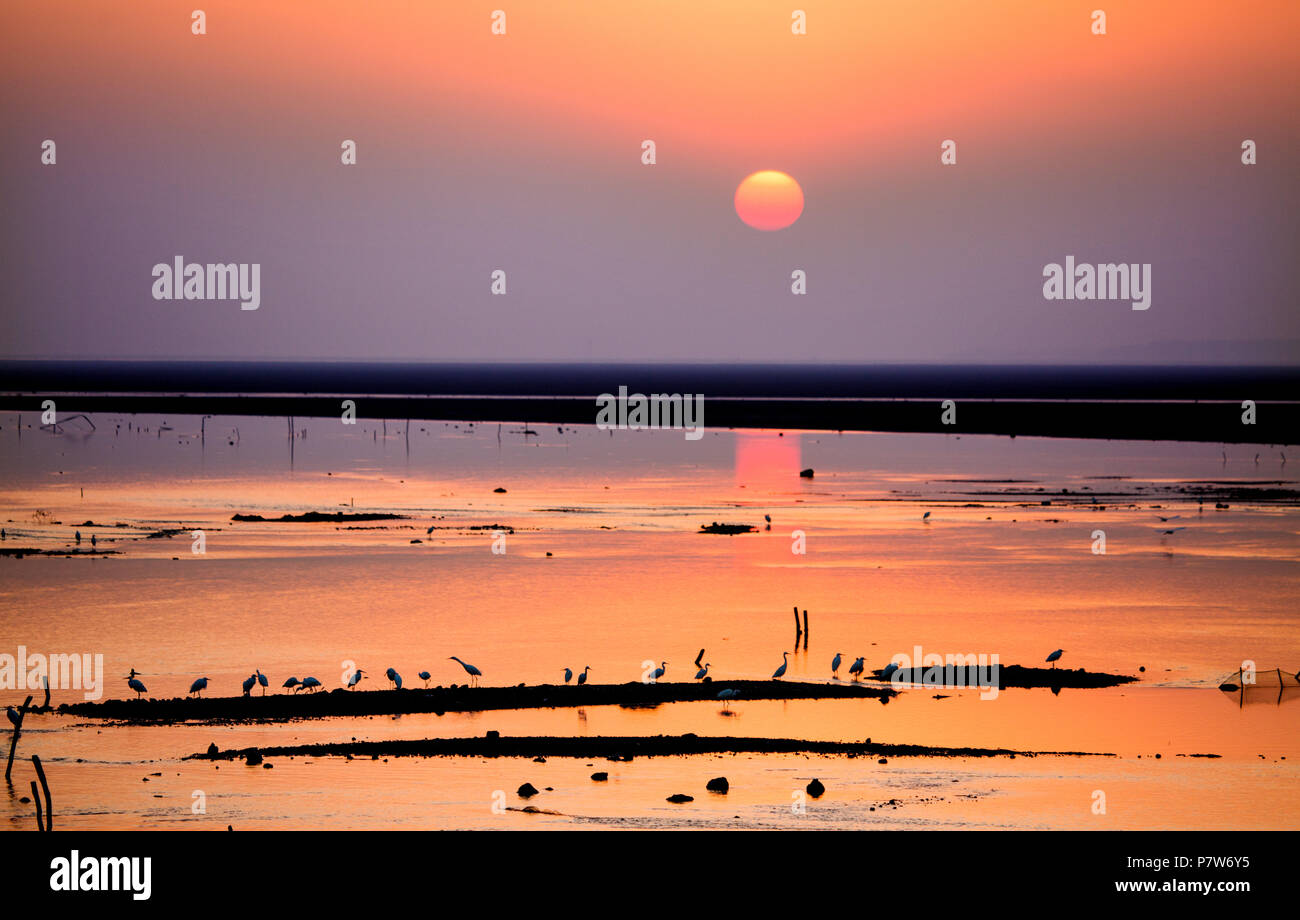 Beijing, China. 8 July 2018. Photo taken on Dec. 28, 2017 shows sunset ...