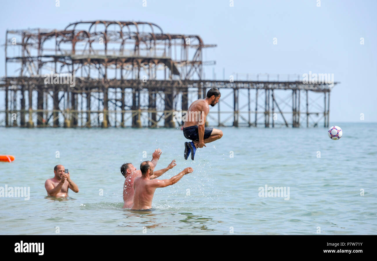 Brighton UK 8th July 2018 - Fun in the sea by the West Pier off ...
