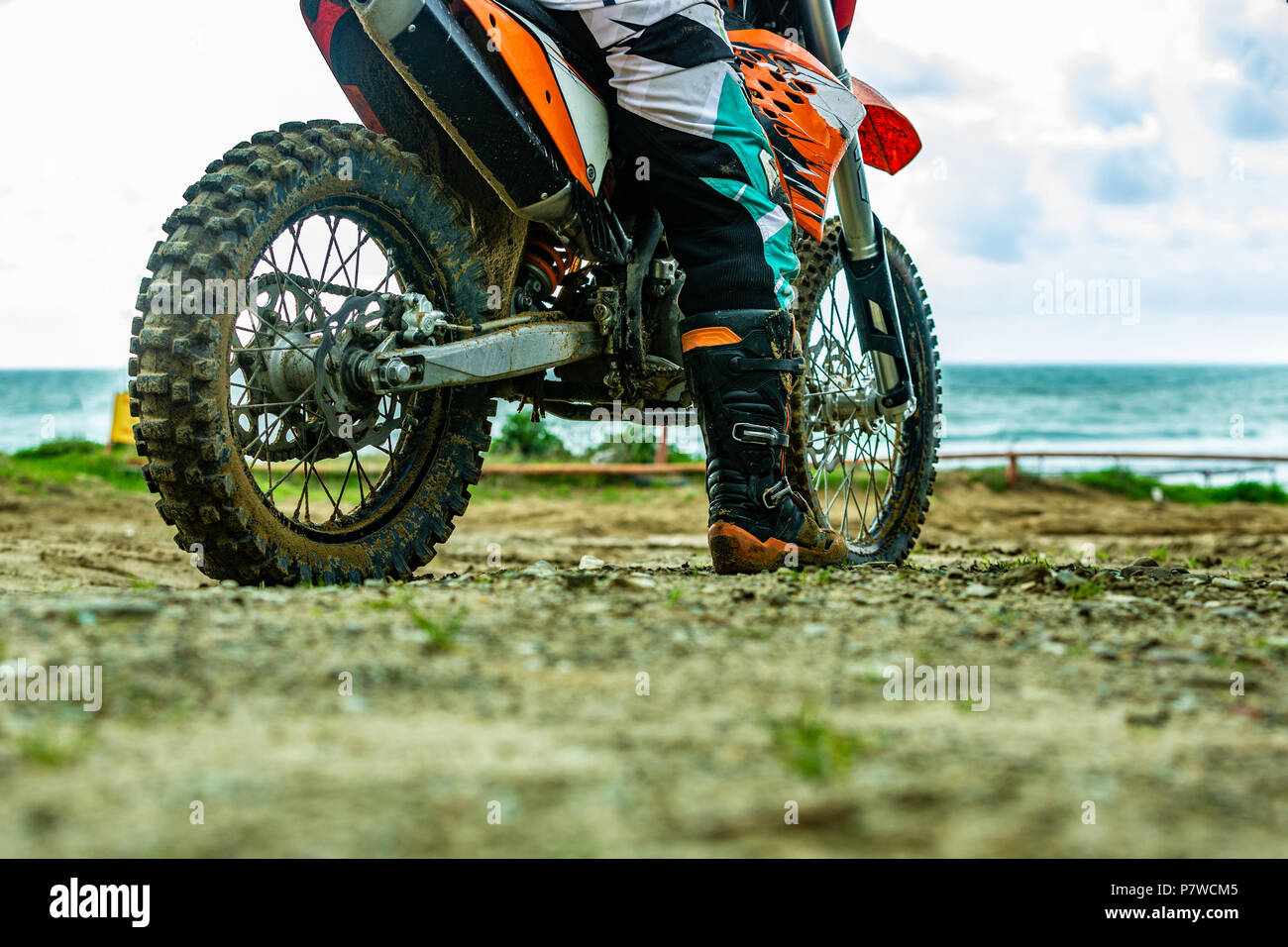 Man Standing Behind Motorcycle Stock Photos & Man Standing Behind ...