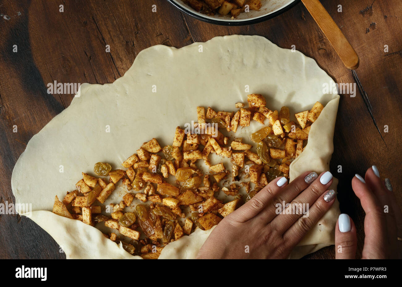 Top view female hands working with dough preparation recipe apple ...