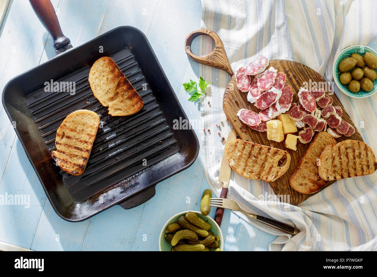 Italian snacks Bruschetta on blue wooden table, top view. Lunch table ...