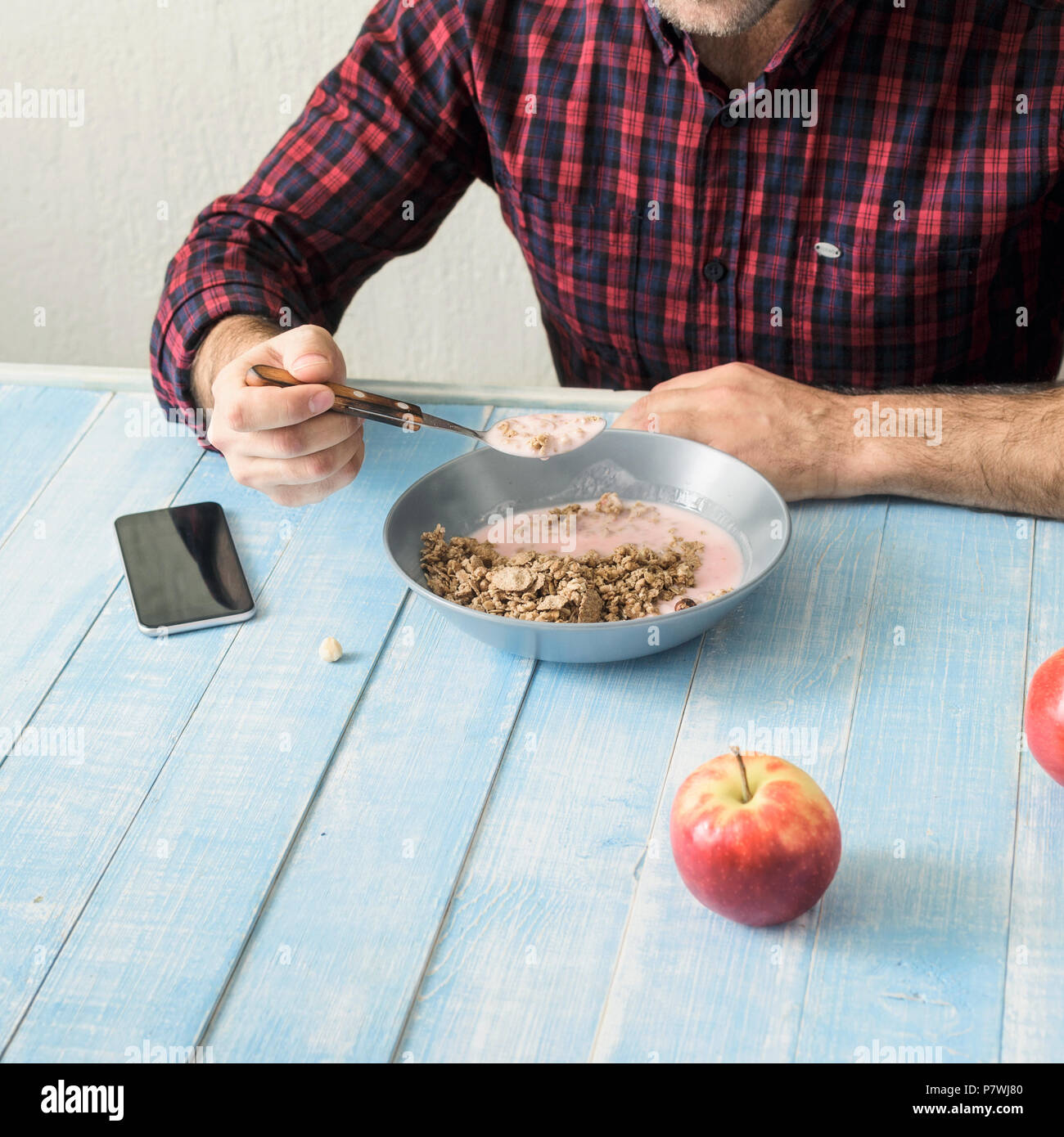 Man eating healthy breakfast in the kitchen at home. Healthy food ...