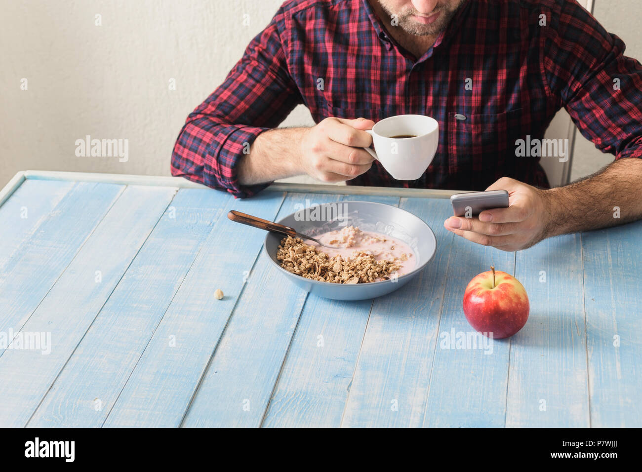 Healthy food concept. Man eating healthy breakfast Stock Photo - Alamy
