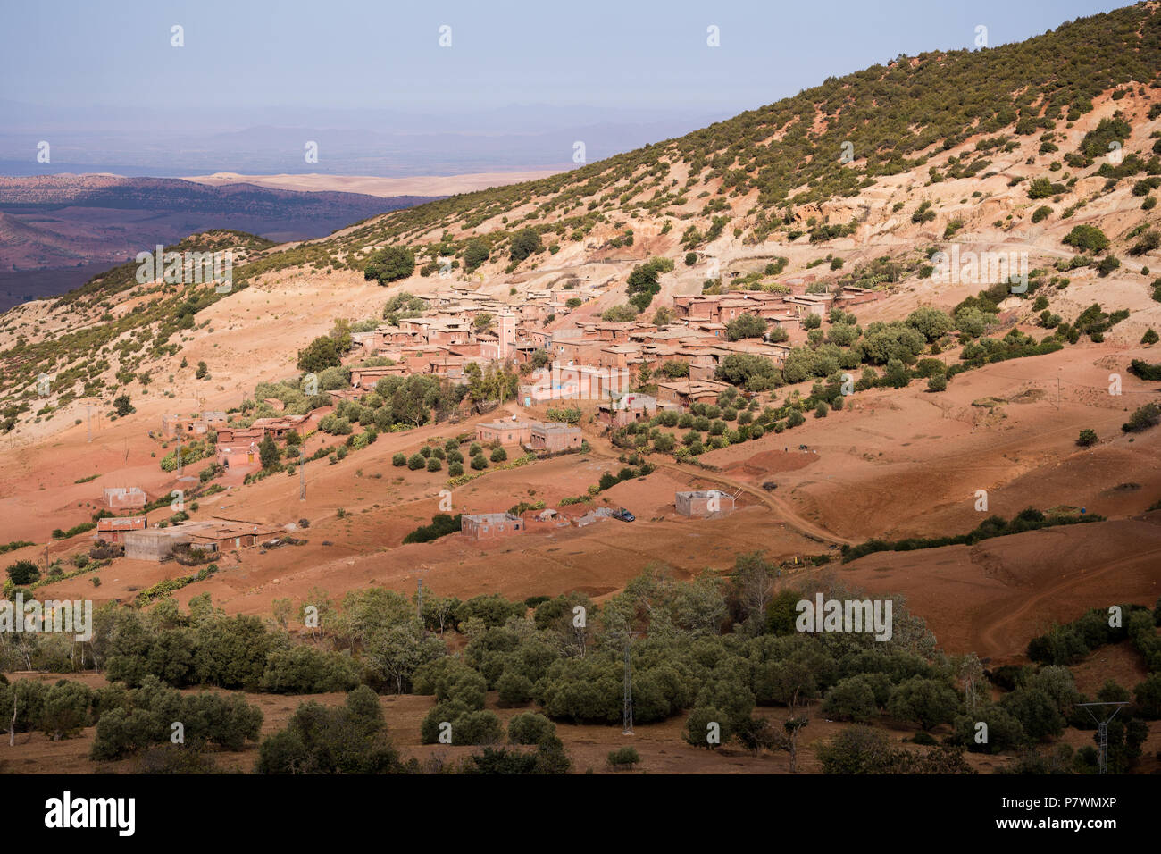 Small Moroccan rural village in Atlas mountains with lots of trees ...