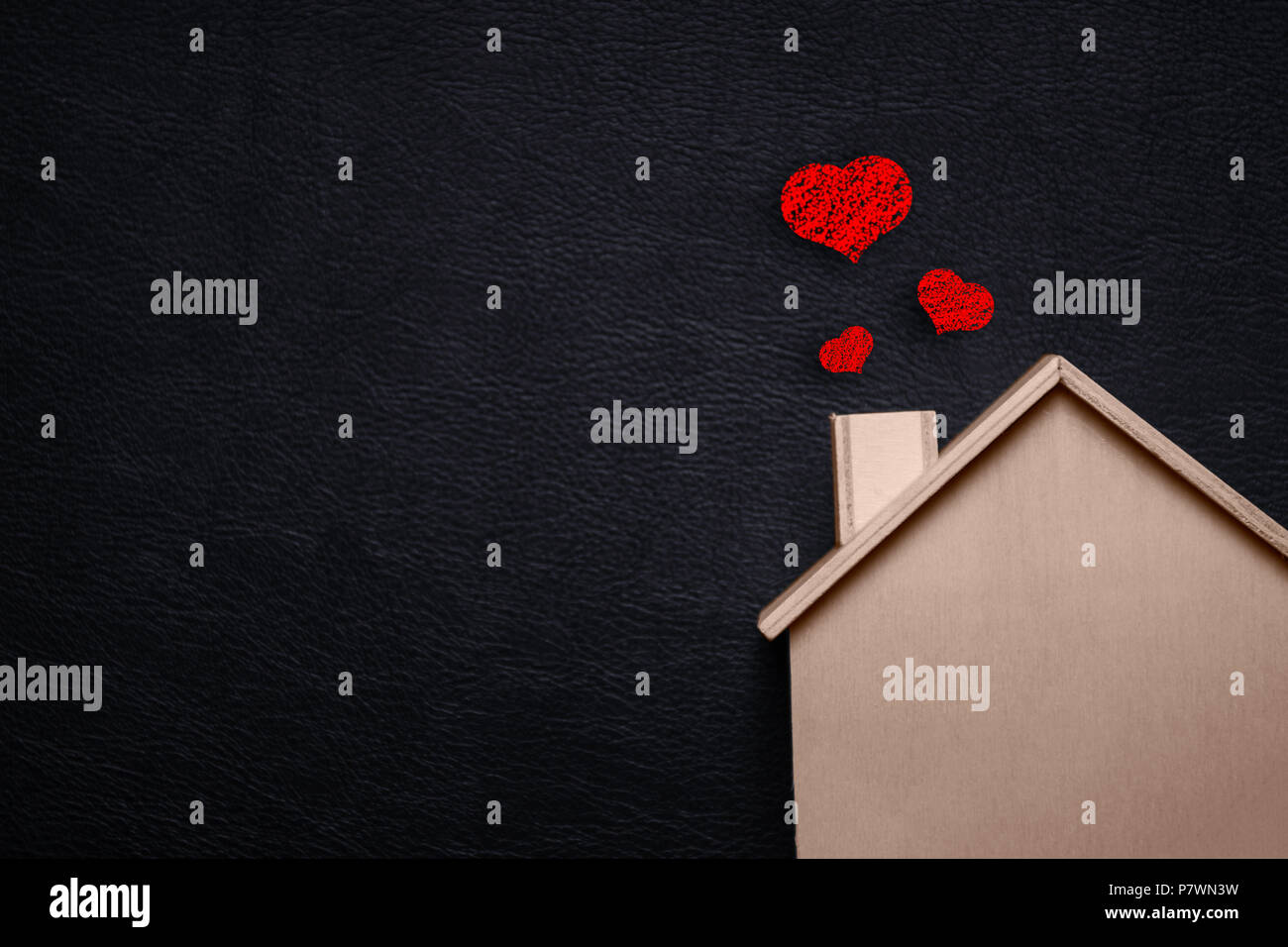 Home sweet home with red heart. Wooden house and Black leather ...