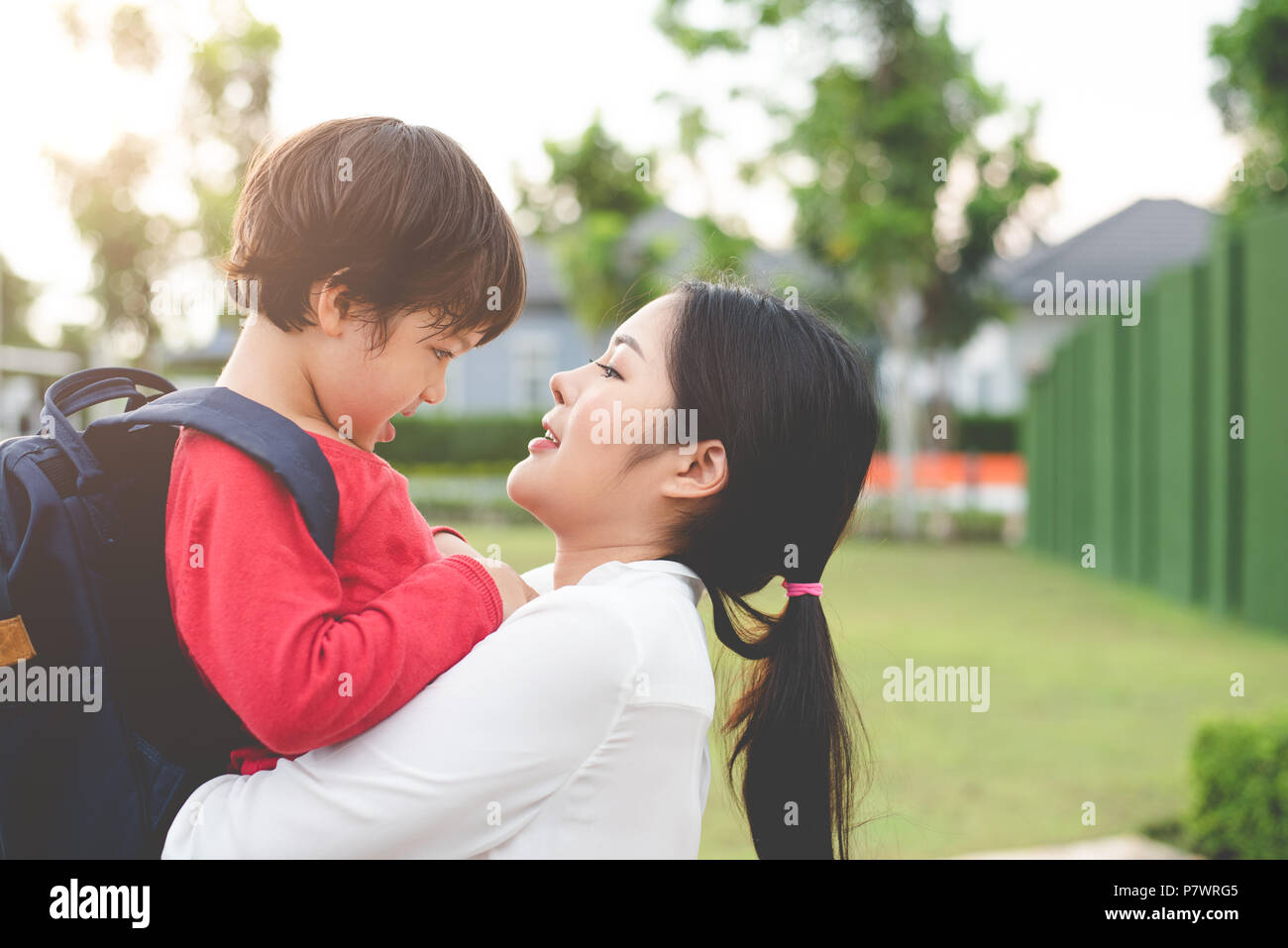 Mom hug and carry her son. Preparing to send her children back to ...