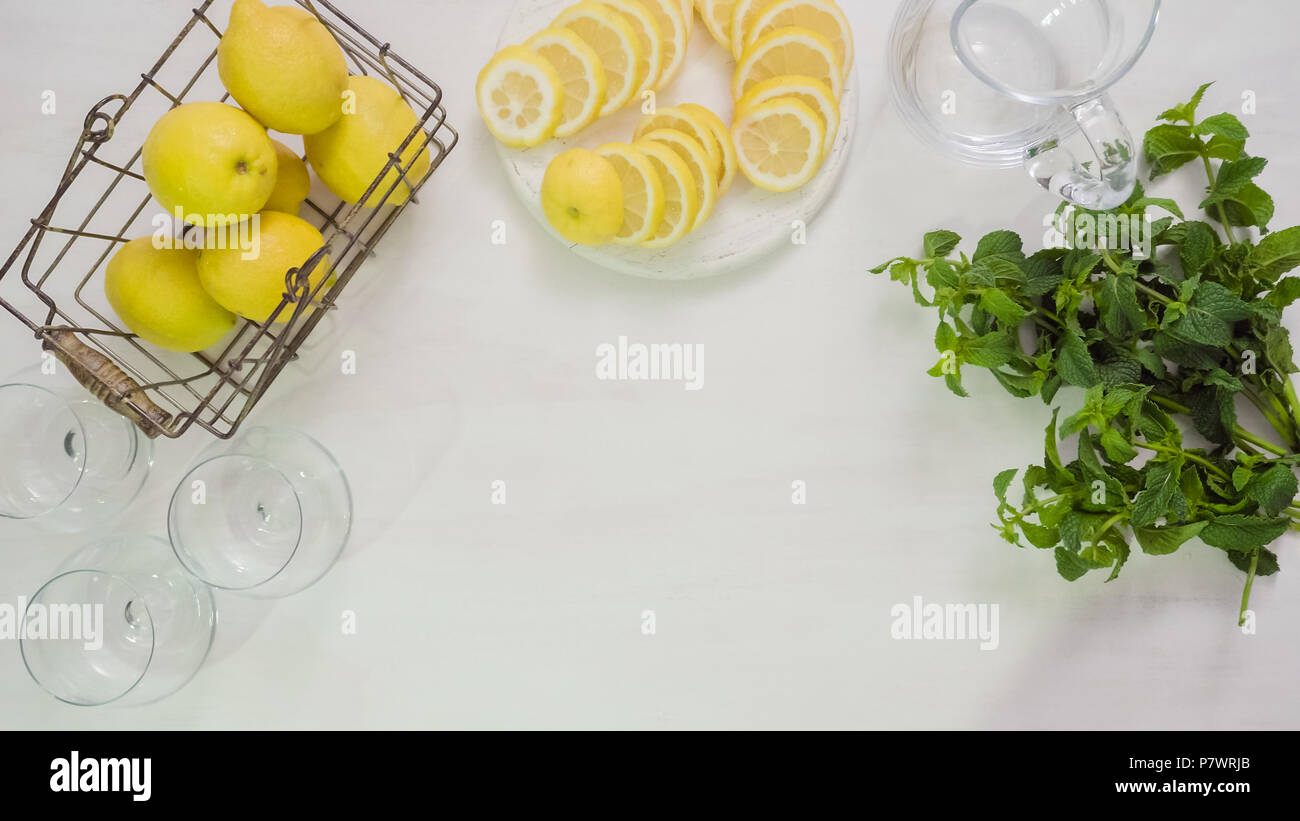 Step by step. Preparing traditional fresh lemonade in glass pitcher ...