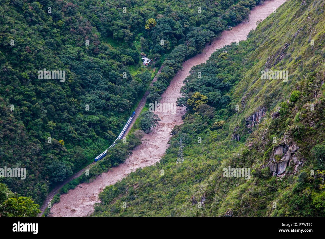 A red water river in the valley surrounded by the wild nature of the ...