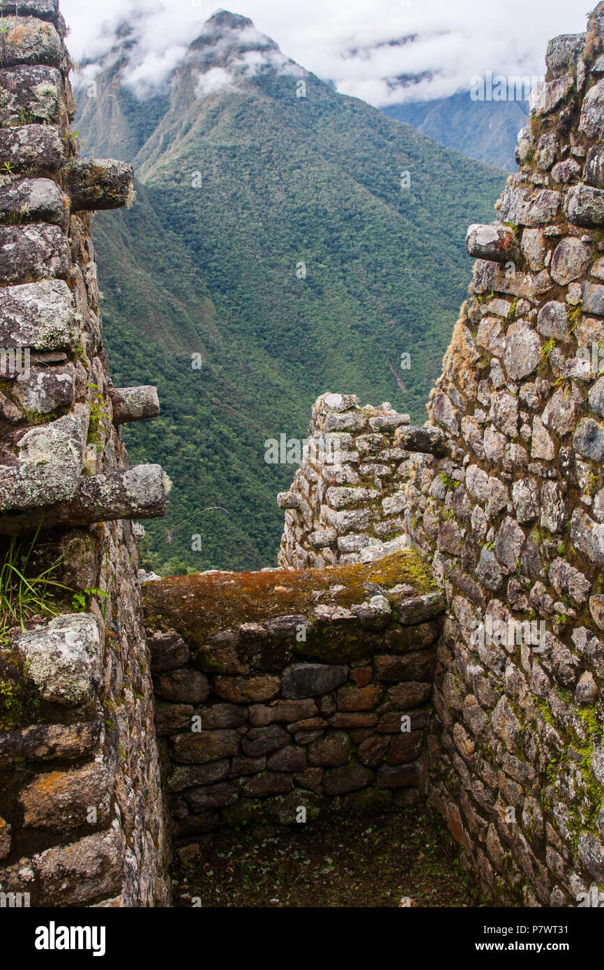 Ancient stone ruins of an Inca town on the Inca Trail in the Andes ...