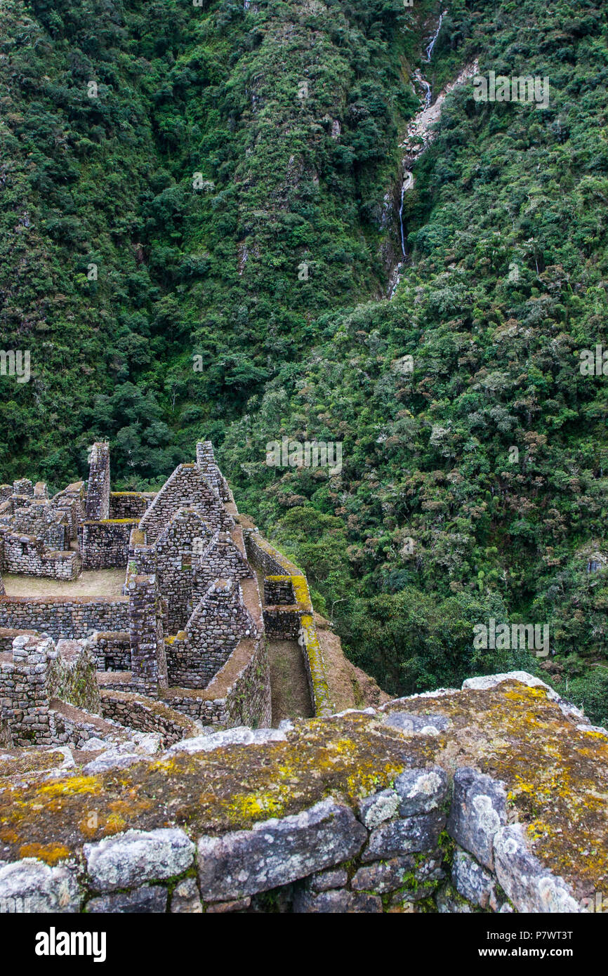 Ancient stone ruins of an Inca town on the Inca Trail in the Andes ...