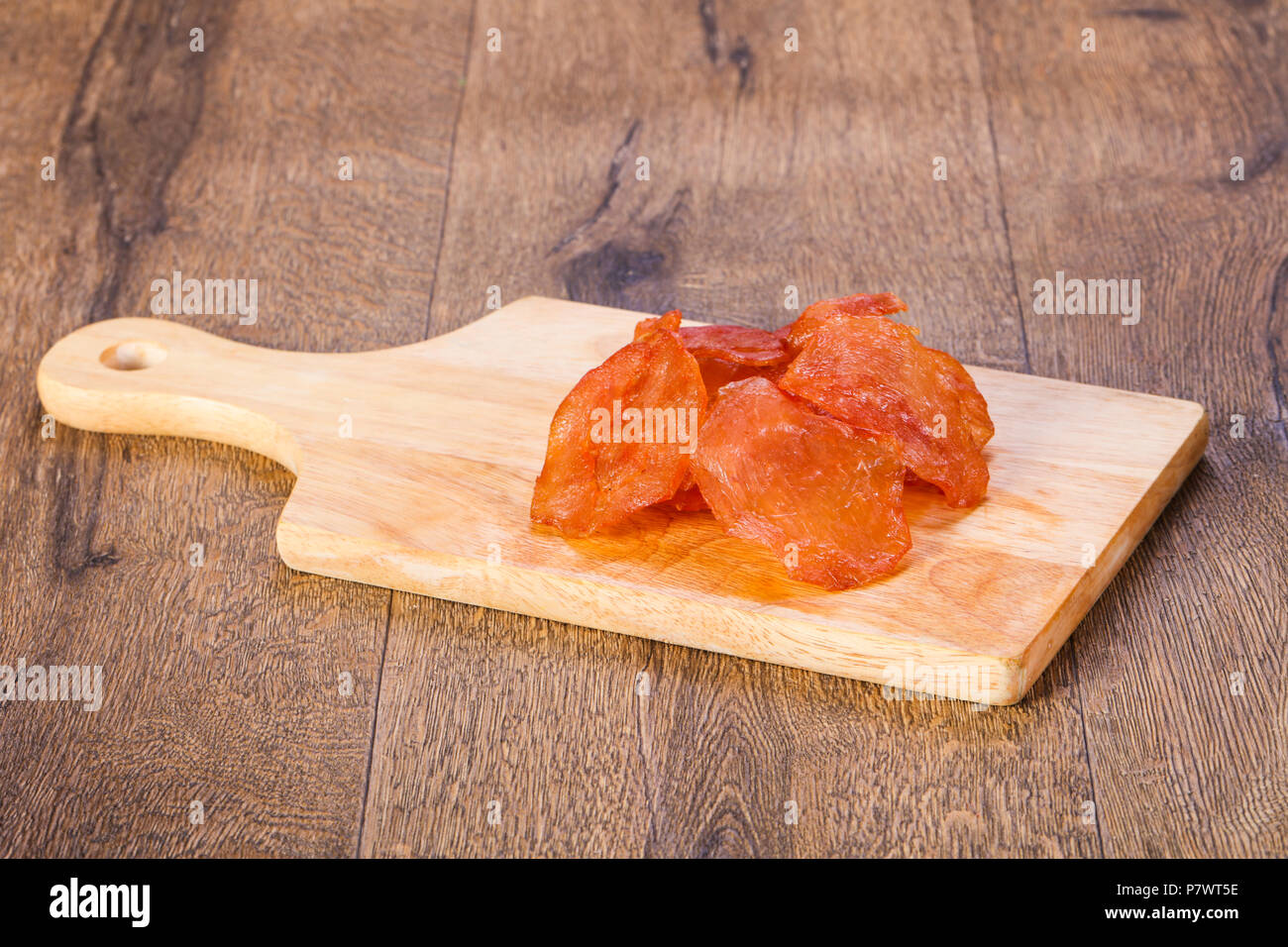 Dry chicken meat over wooden Stock Photo - Alamy