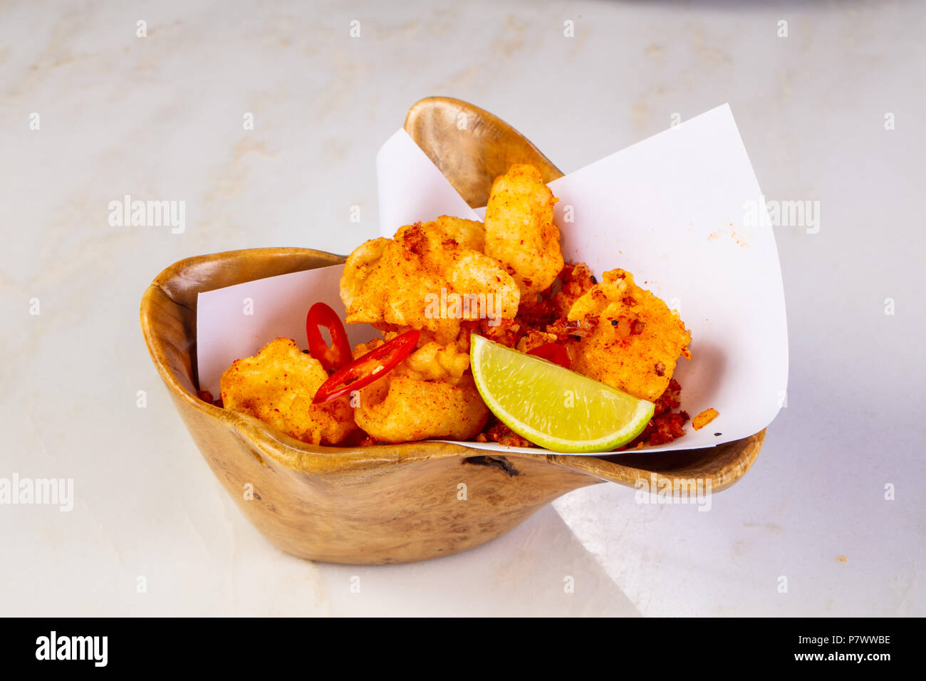 Crispy squid with chili and lemon Stock Photo - Alamy