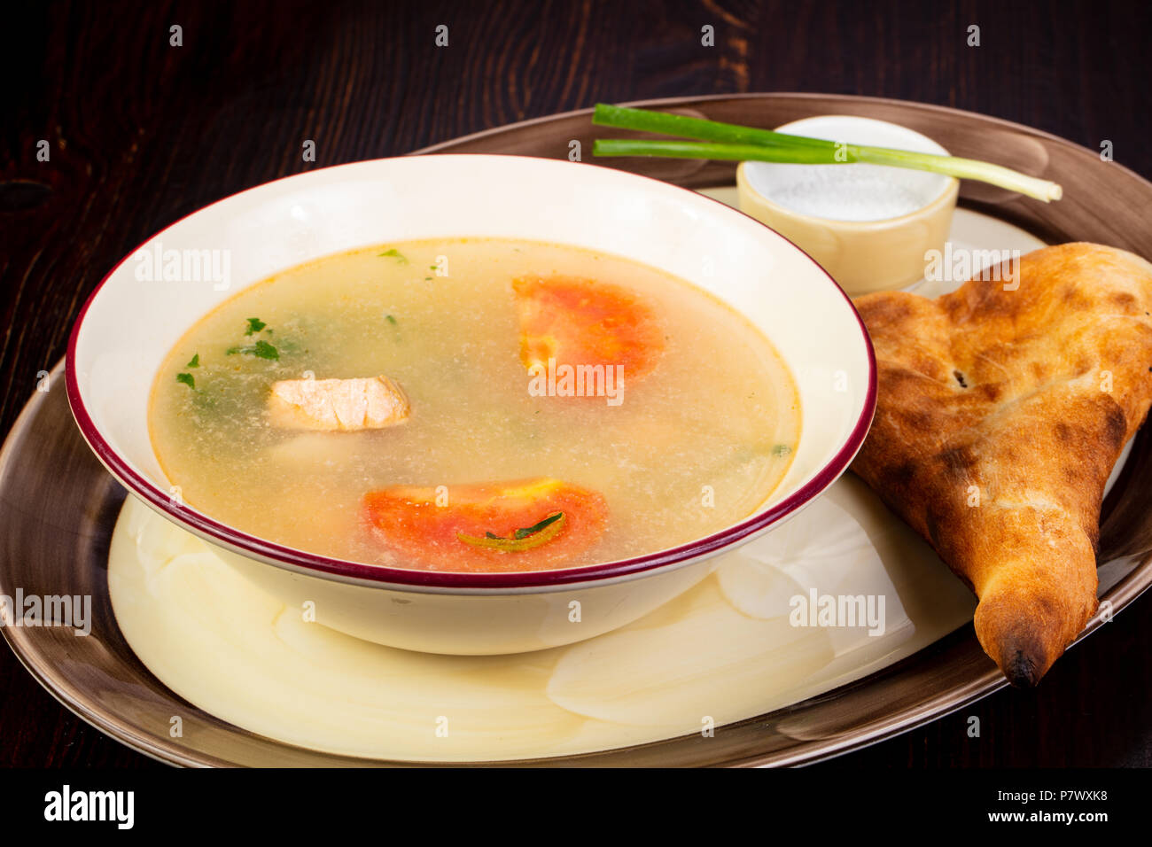 Fish soup with bread and green onion Stock Photo - Alamy