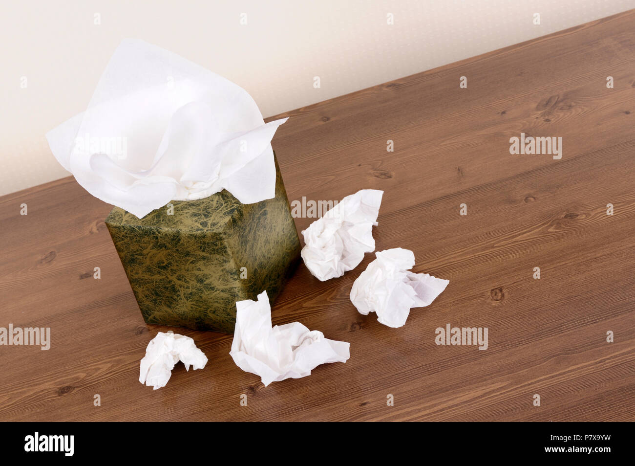 Box of tissues on a wood table Stock Photo - Alamy
